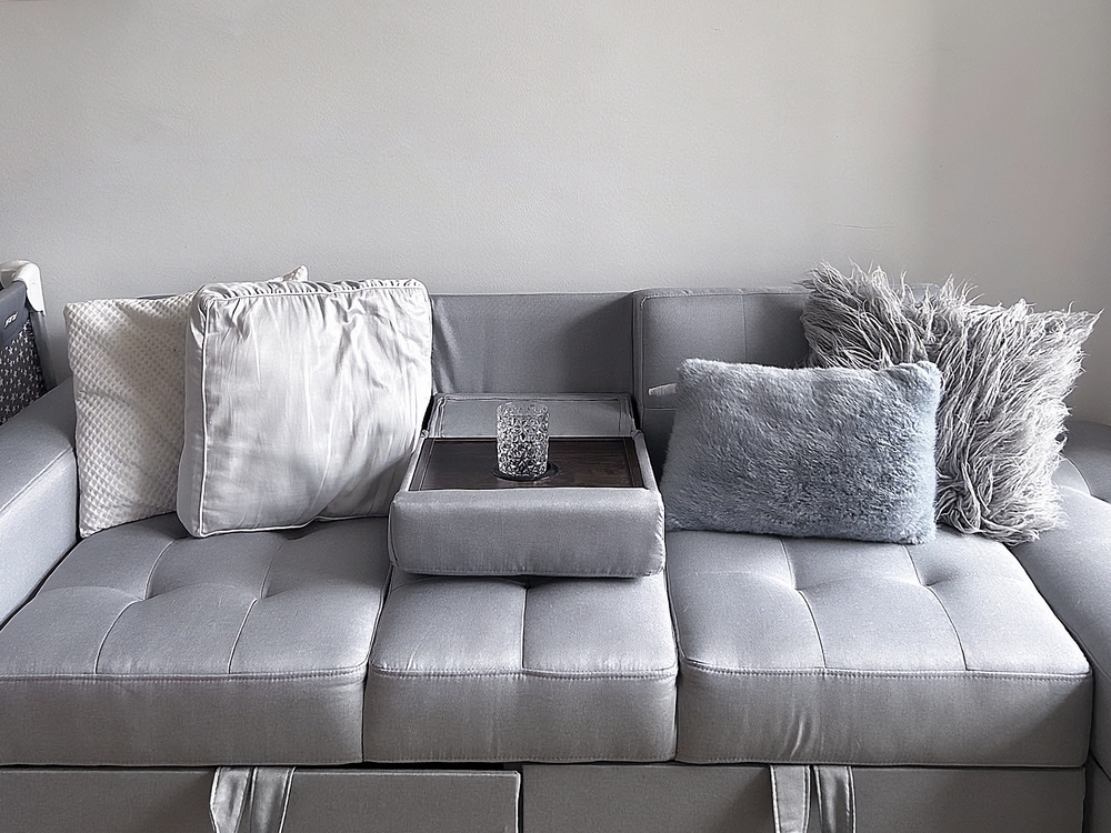 Light grey sectional with ottoman store
